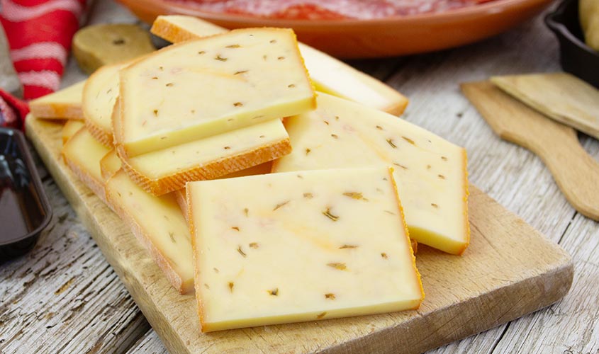 40% Fromage à raclette suisse fines herbes, en tranches - Fromage | Bofrost